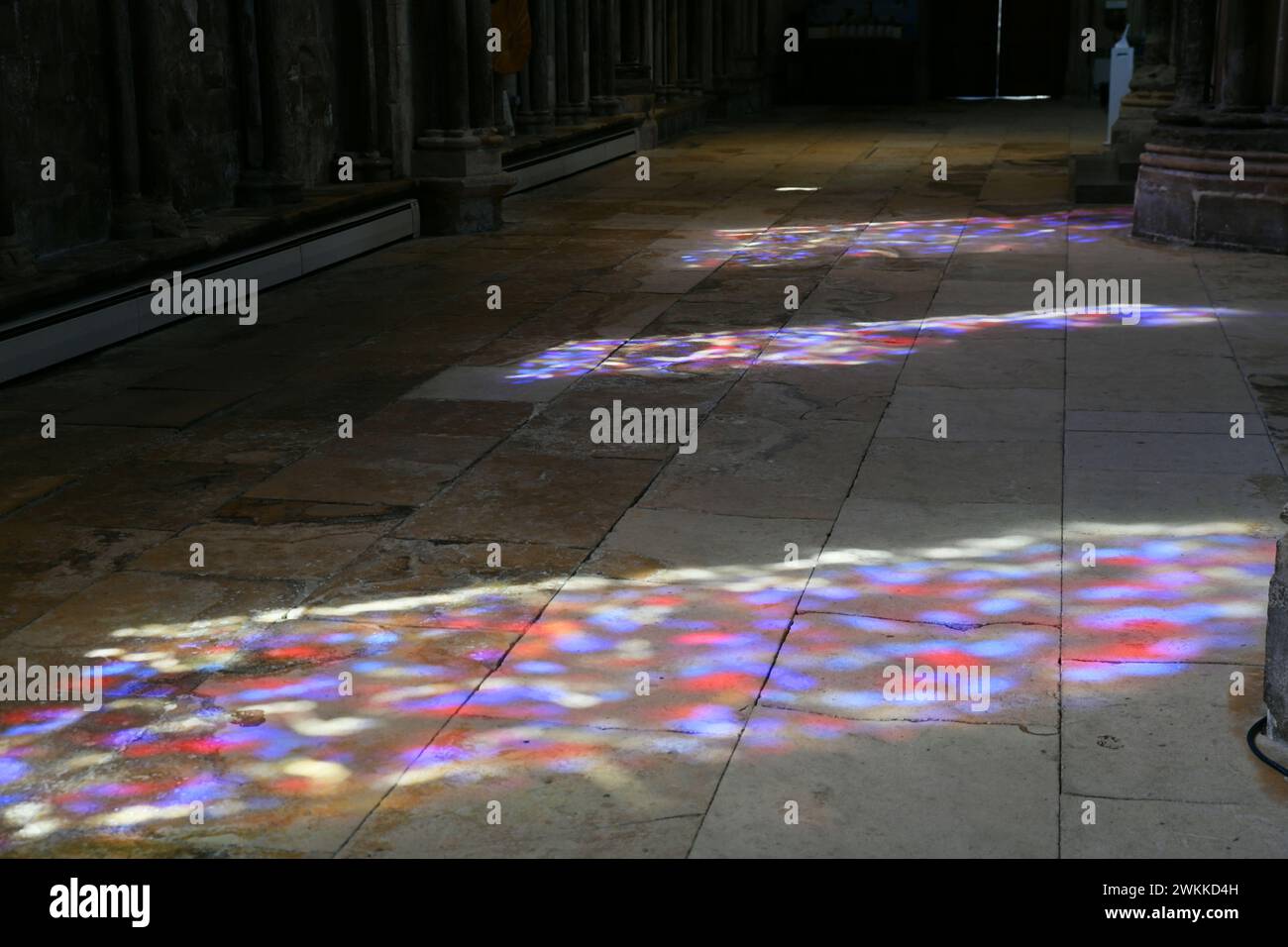 Colours And Patterns Of Stained Glass Windows Reflected On The Floor Of