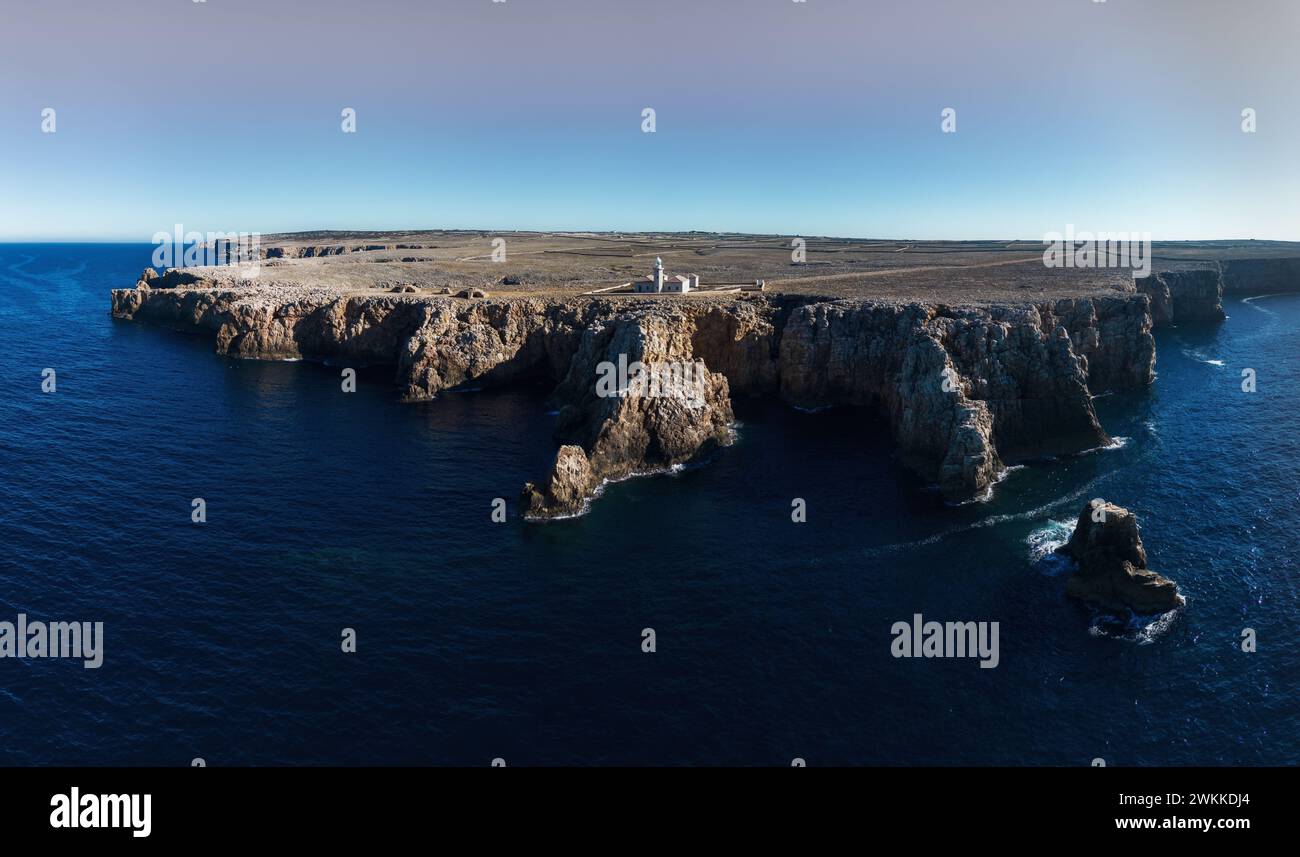 drone view of the Punta Nati lighthouse and coastal cliffs in ...