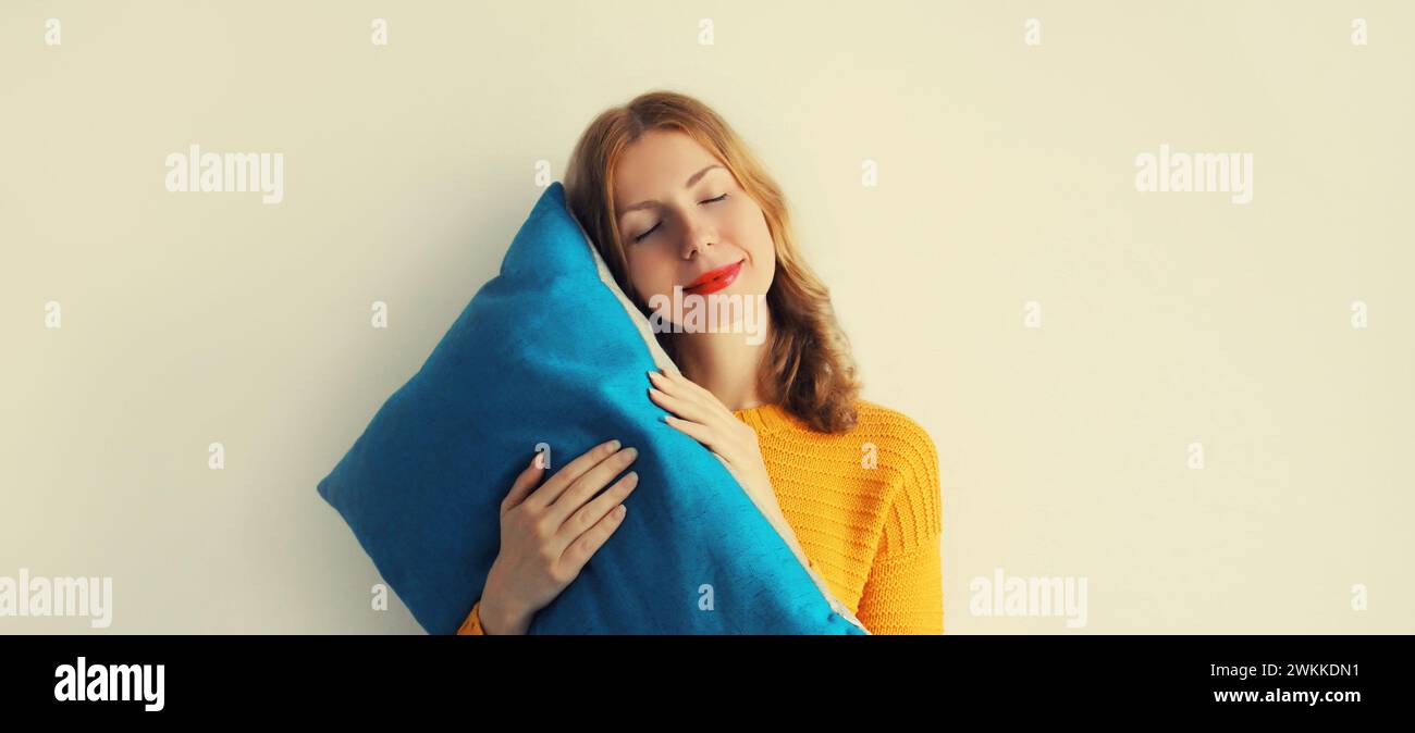 Healthy sleep, happy relaxed sleepy young woman hugs her soft ...