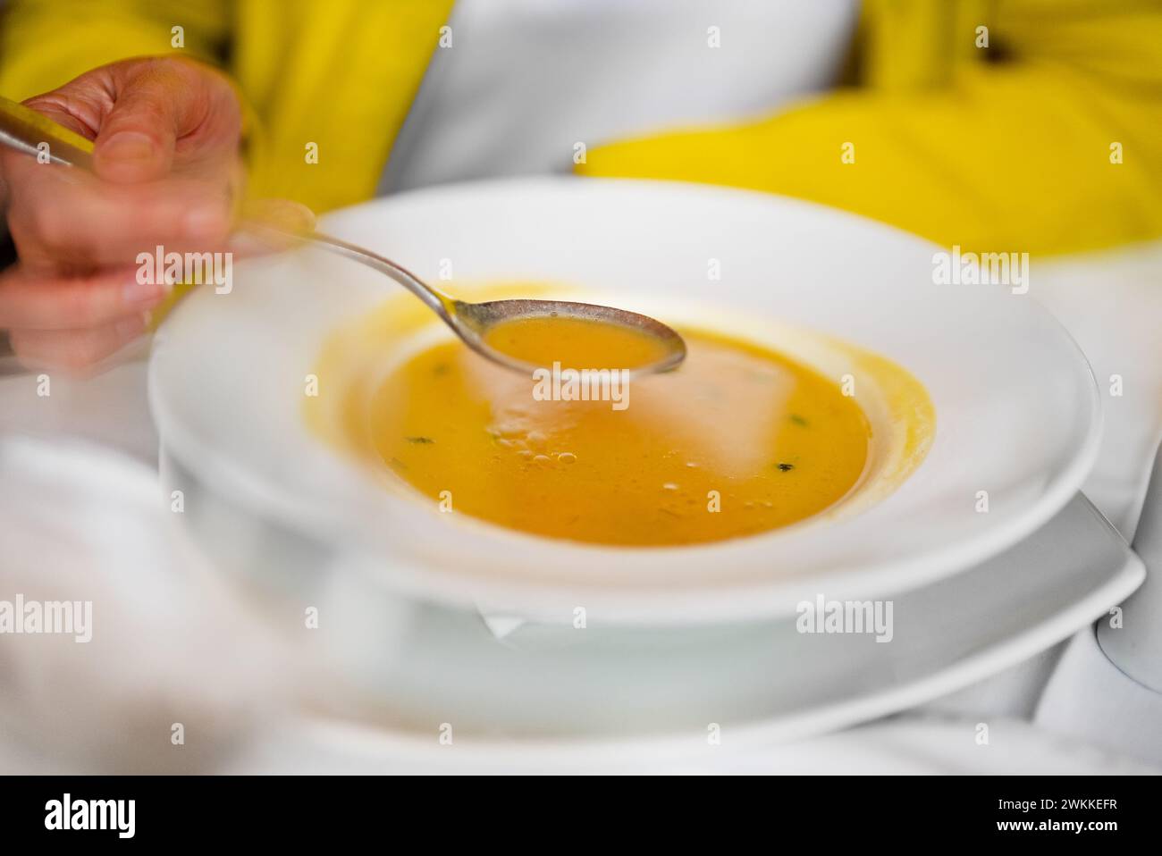Woman cooking soup in bowl hi-res stock photography and images - Alamy