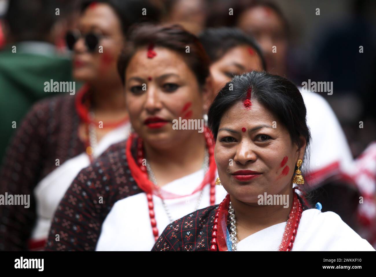Lalitpur, Nepal. 21st Feb, 2024. Women take part in a parade during Bhimsen Puja celebration in ...