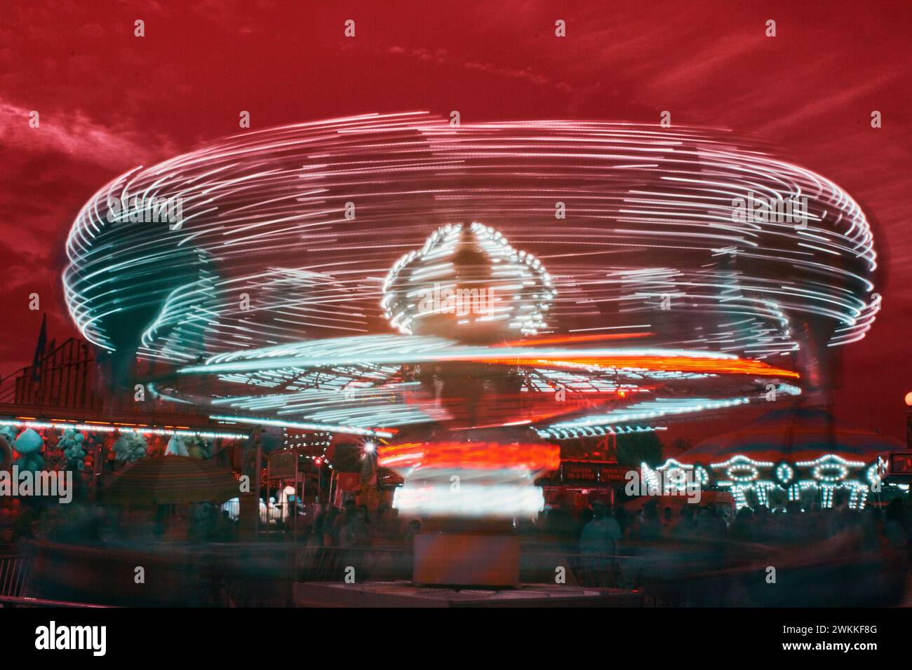 Infrared Carnival Ride Light Trails at Dusk, Amusement Park Energy ...
