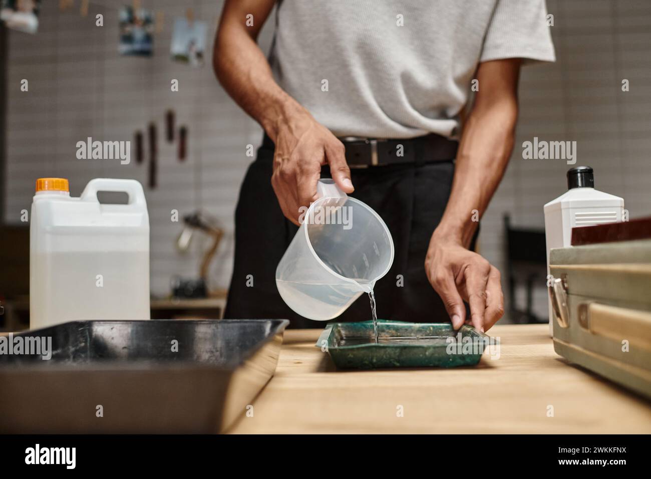 meticulous process of film development, crop african american man ...