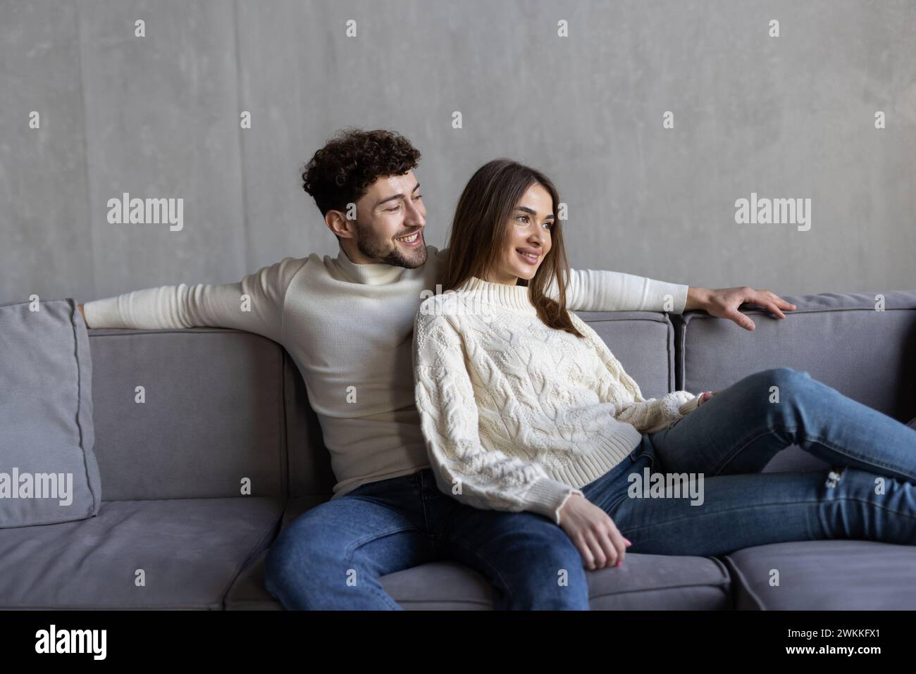 Happy couple or marriage hugging and enjoying in a couch at home Stock ...