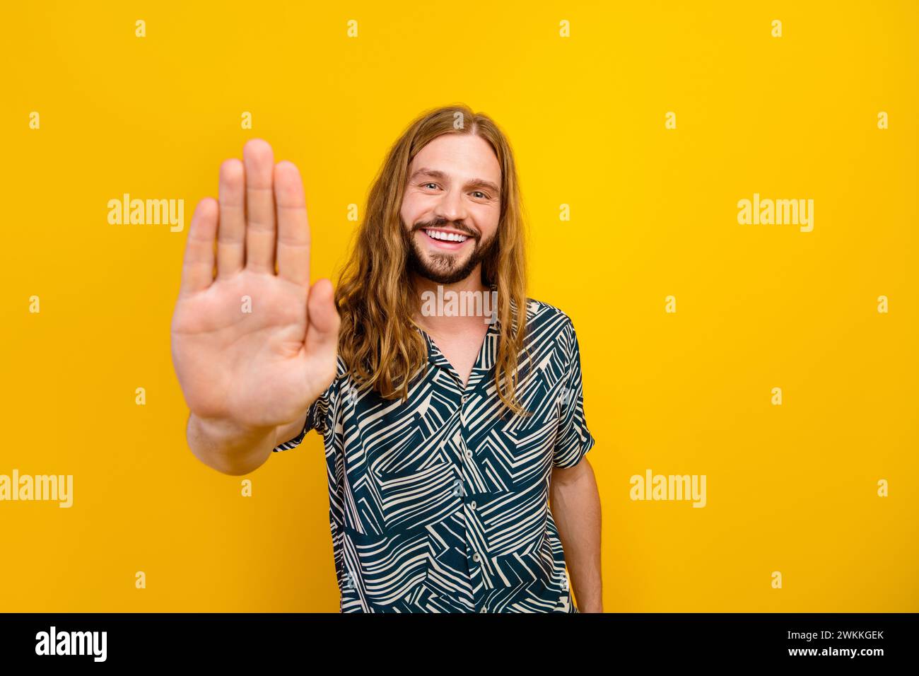 Photo of attractive funky guy wear print shirt showing arm palm high ...