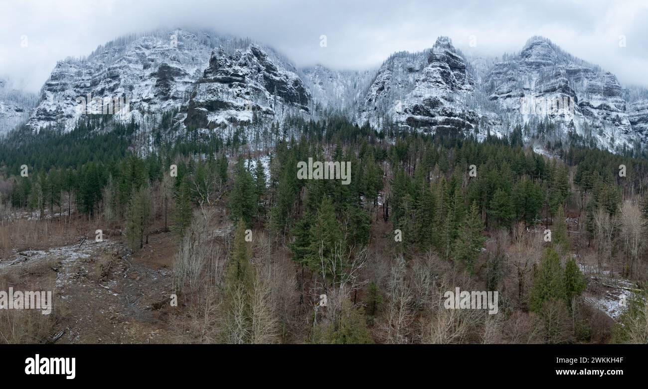 Clouds and snow covers the rugged mountain landscape in the Columbia ...