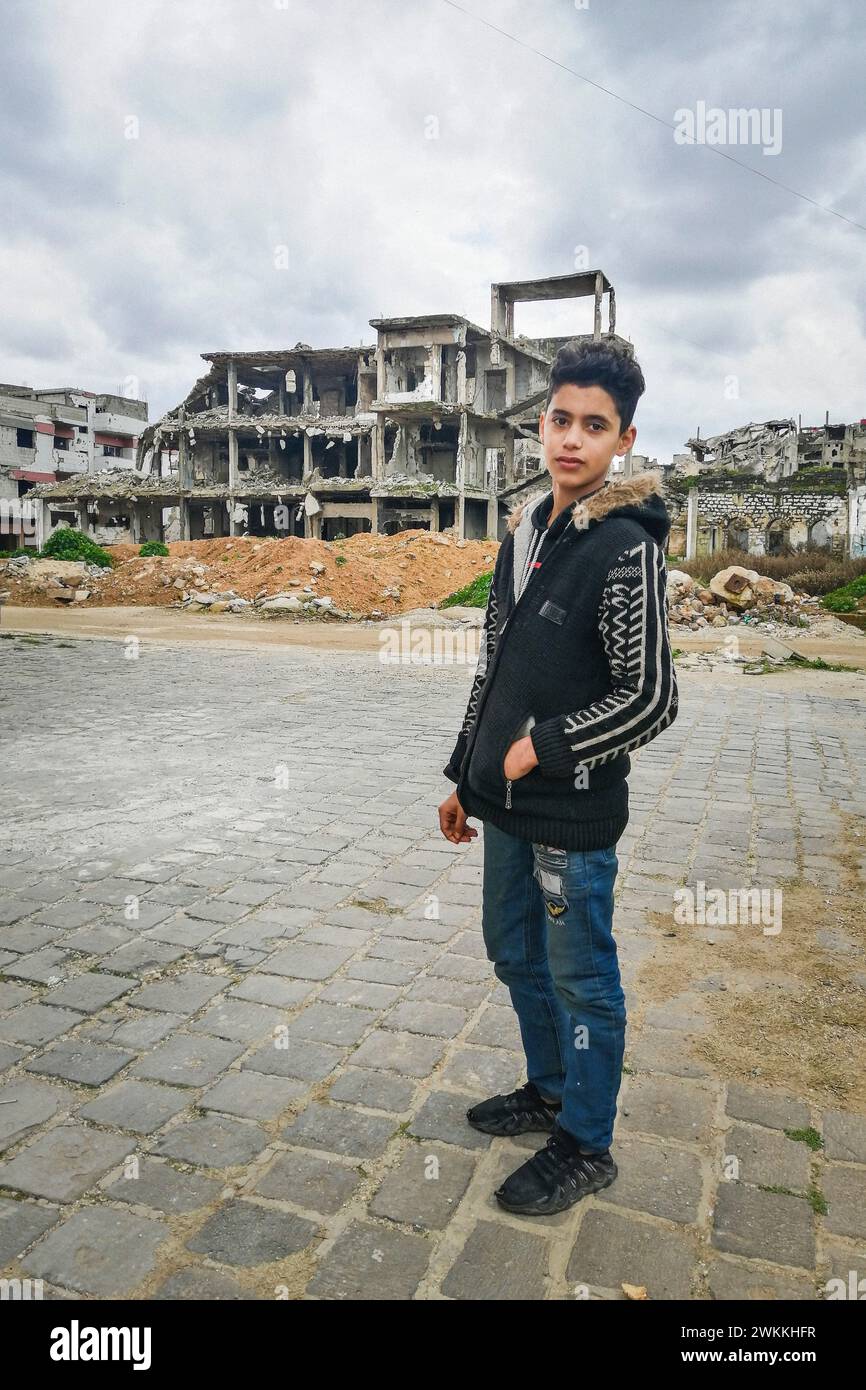 Syria, Homs, bombings on destroyed buildings, boy Stock Photo - Alamy