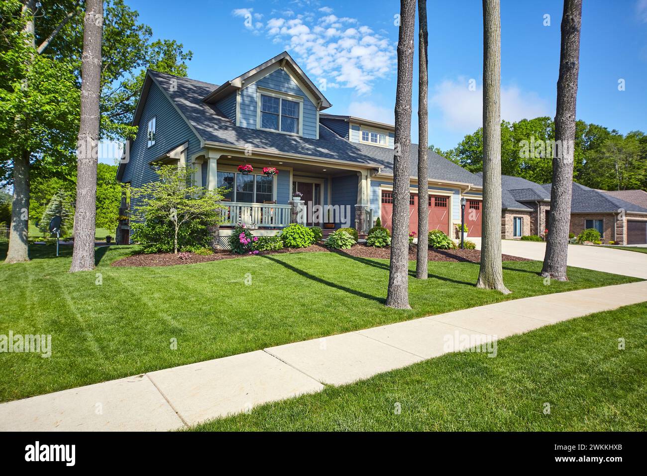 Classic American Suburban Home with Manicured Lawn and Landscaping ...
