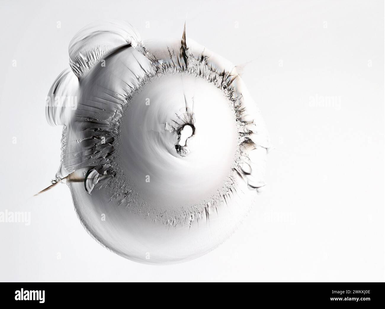 Broken glass close up texture on white background. Bullet hole in ...