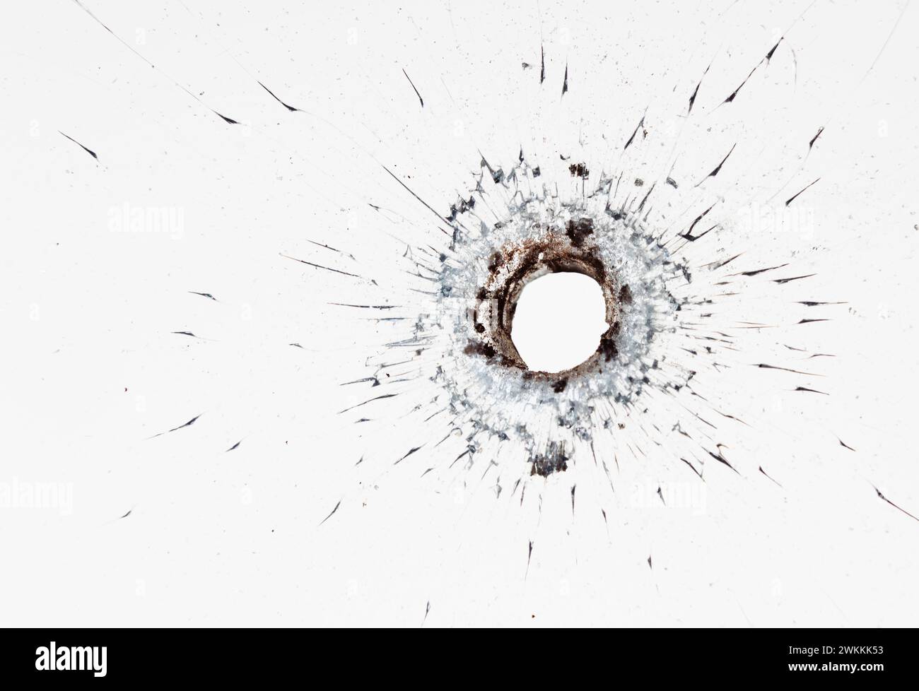 Big hole in cracked window on white background. Broken glass texture ...