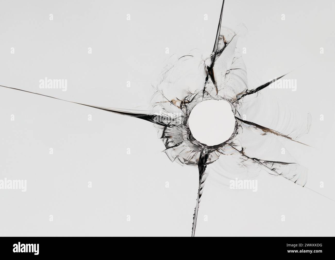 Broken glass. Cracked window. Bullet hole in window on white background ...