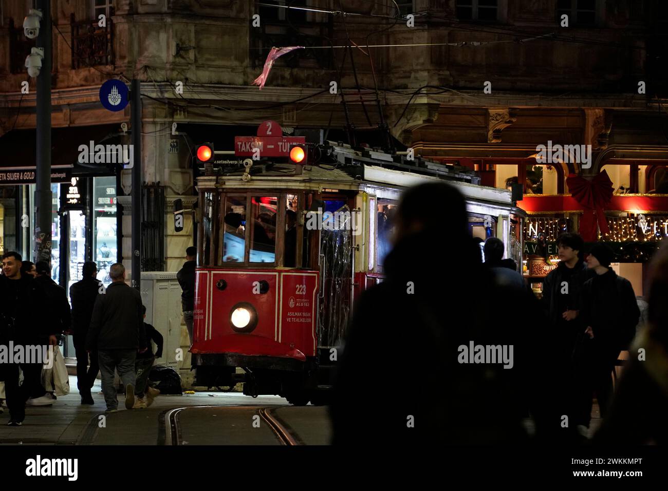 ISTANBUL, TURKEY - JANUARY 5, 2022: historic red Tram going via one of ...