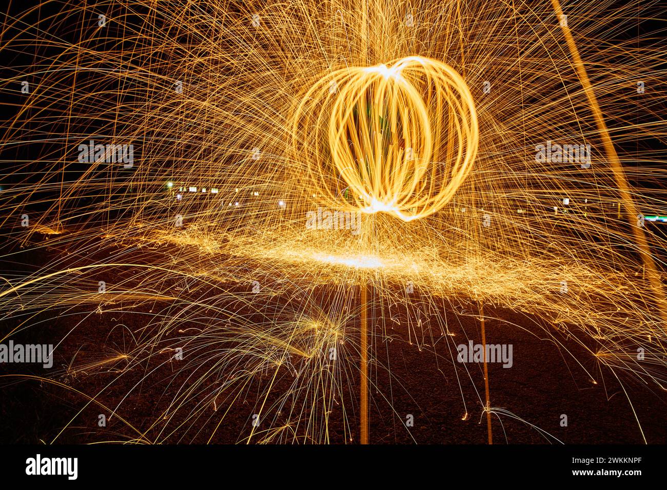 Fire Spinning Performance at Night with Light Trails and Sparks Stock ...