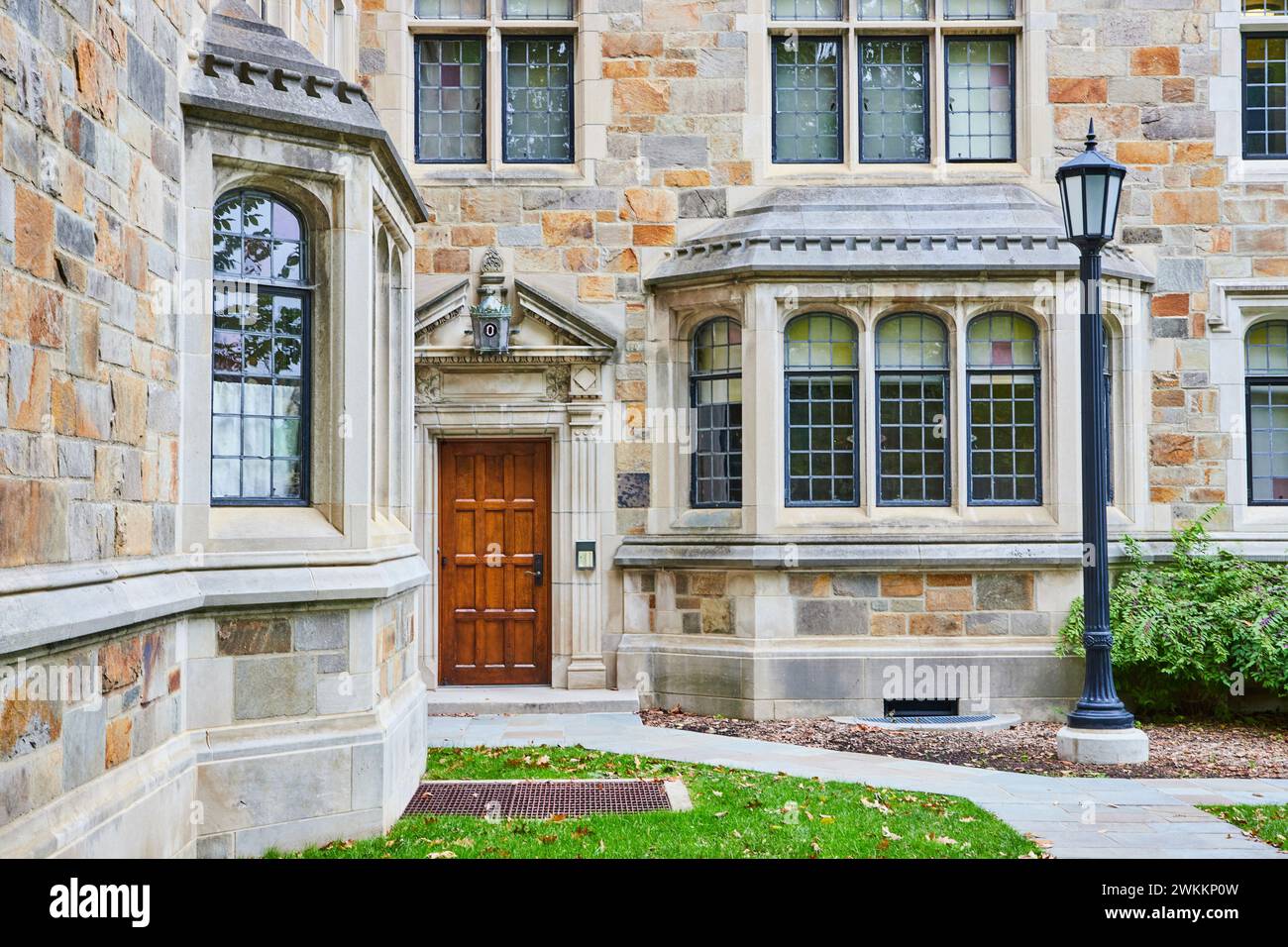 Classic University Building Facade with Stonework and Arched Entrance ...