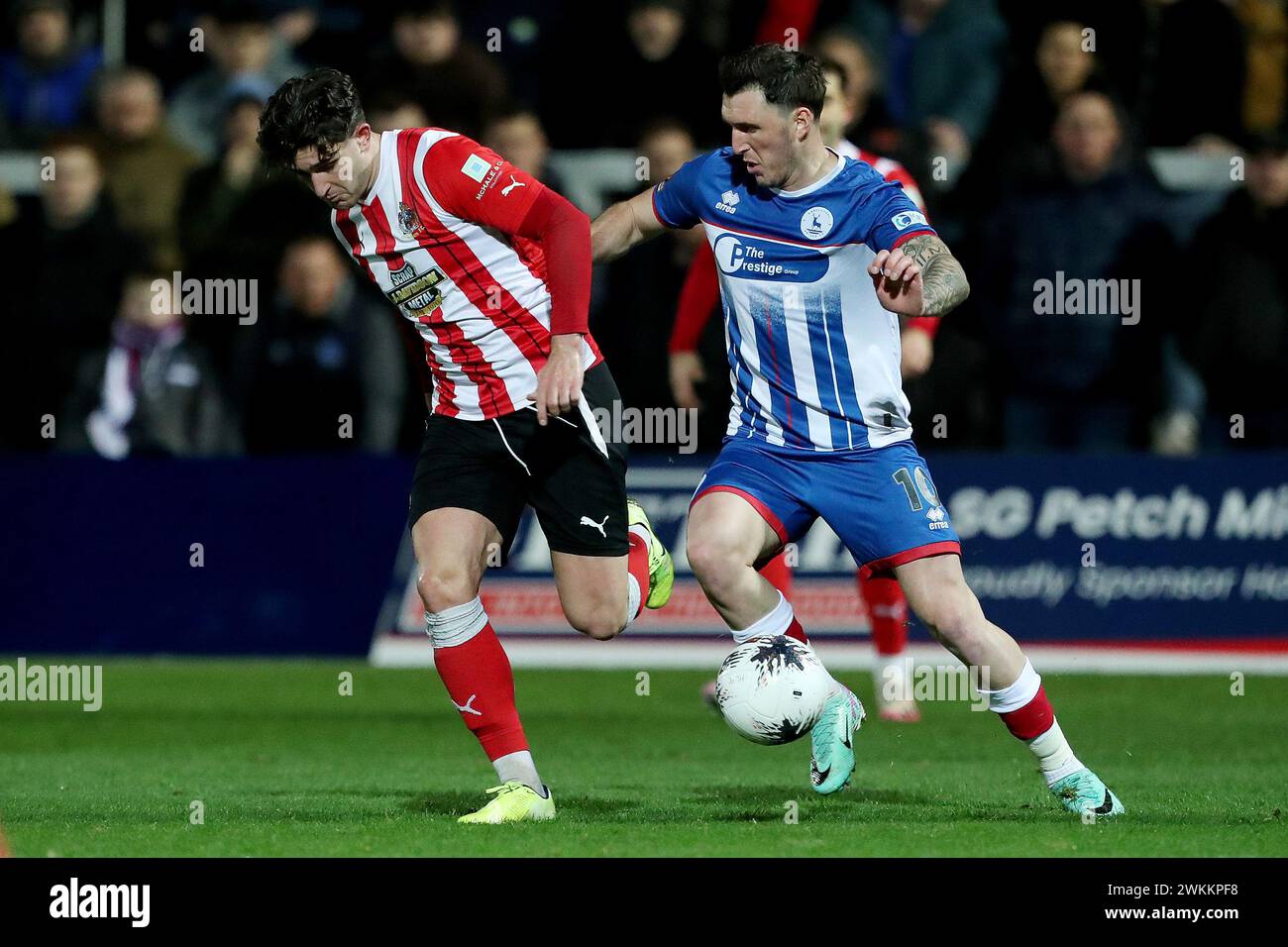 Altrincham's Elliot Osborne in action with Callum Cooke of Hartlepool ...