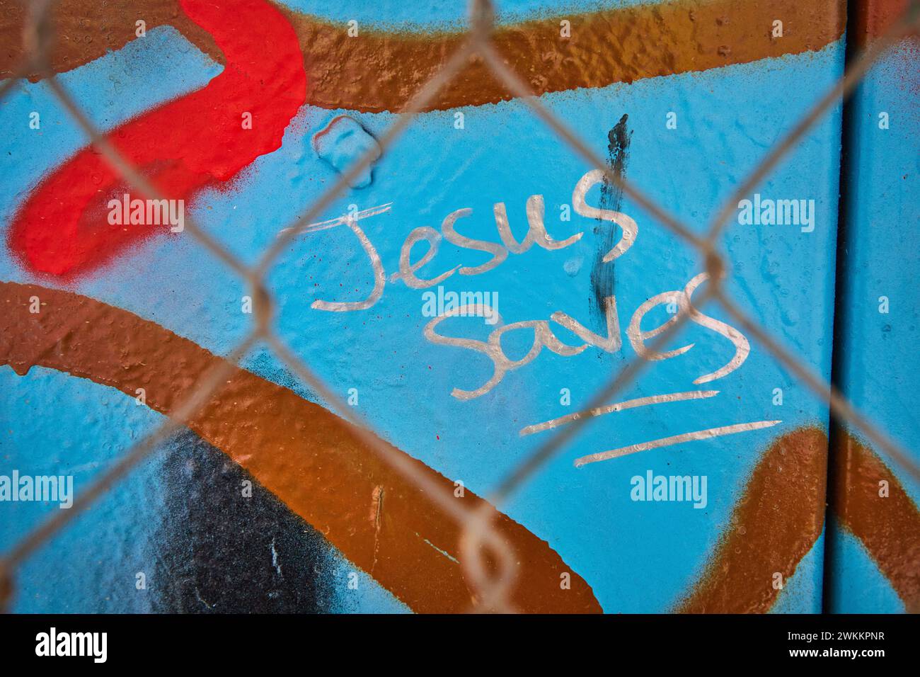 Graffiti Message of Faith Through Chain-Link Fence Stock Photo - Alamy