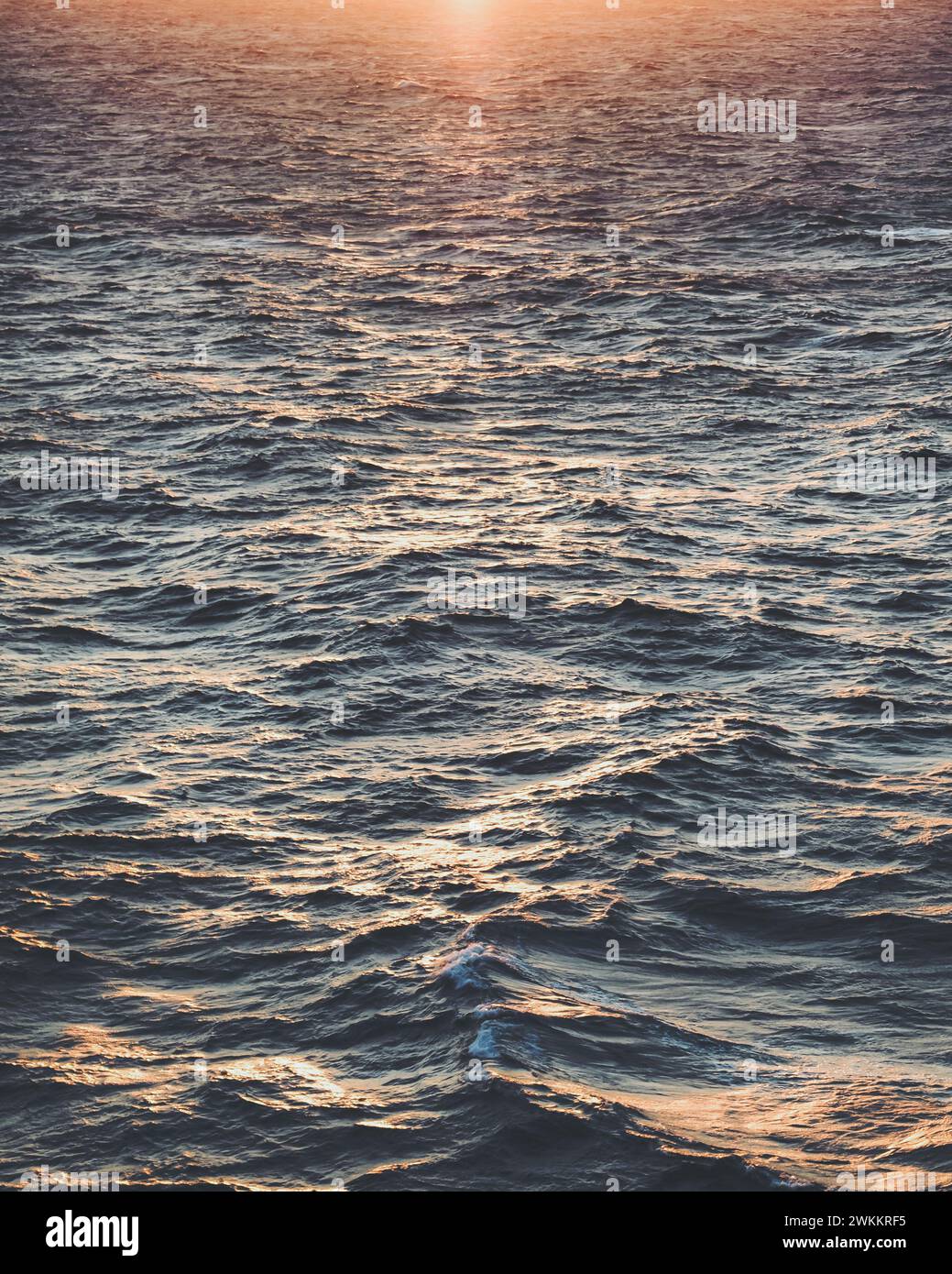 sunset warms the choppy waters Stock Photo - Alamy