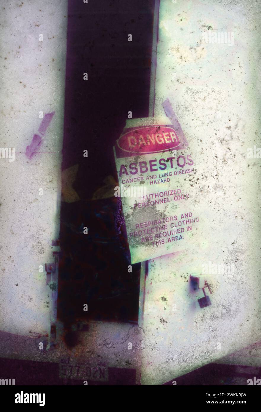 Sign warning of dangerous asbestos stored in trailer at construction ...