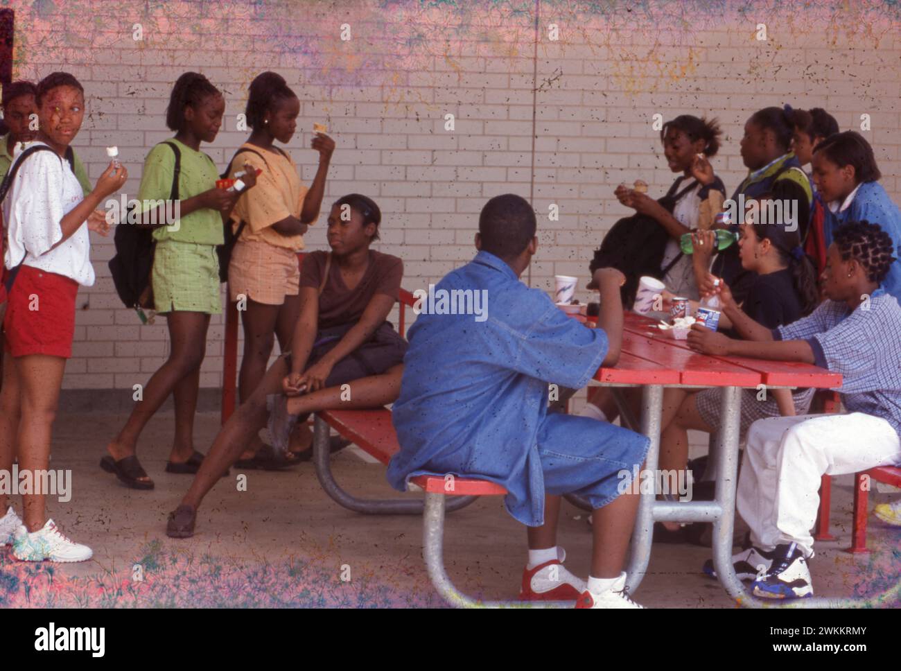 Austin Texas: Black middle school students socialize around picnic ...