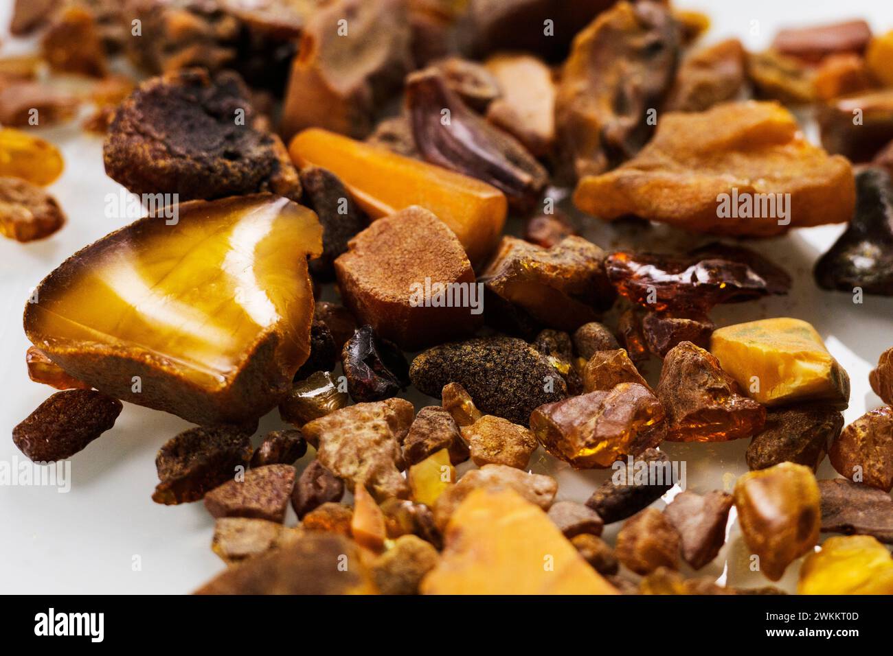 Yellow and orange raw amber pieces of different shapes. Raw materials ...
