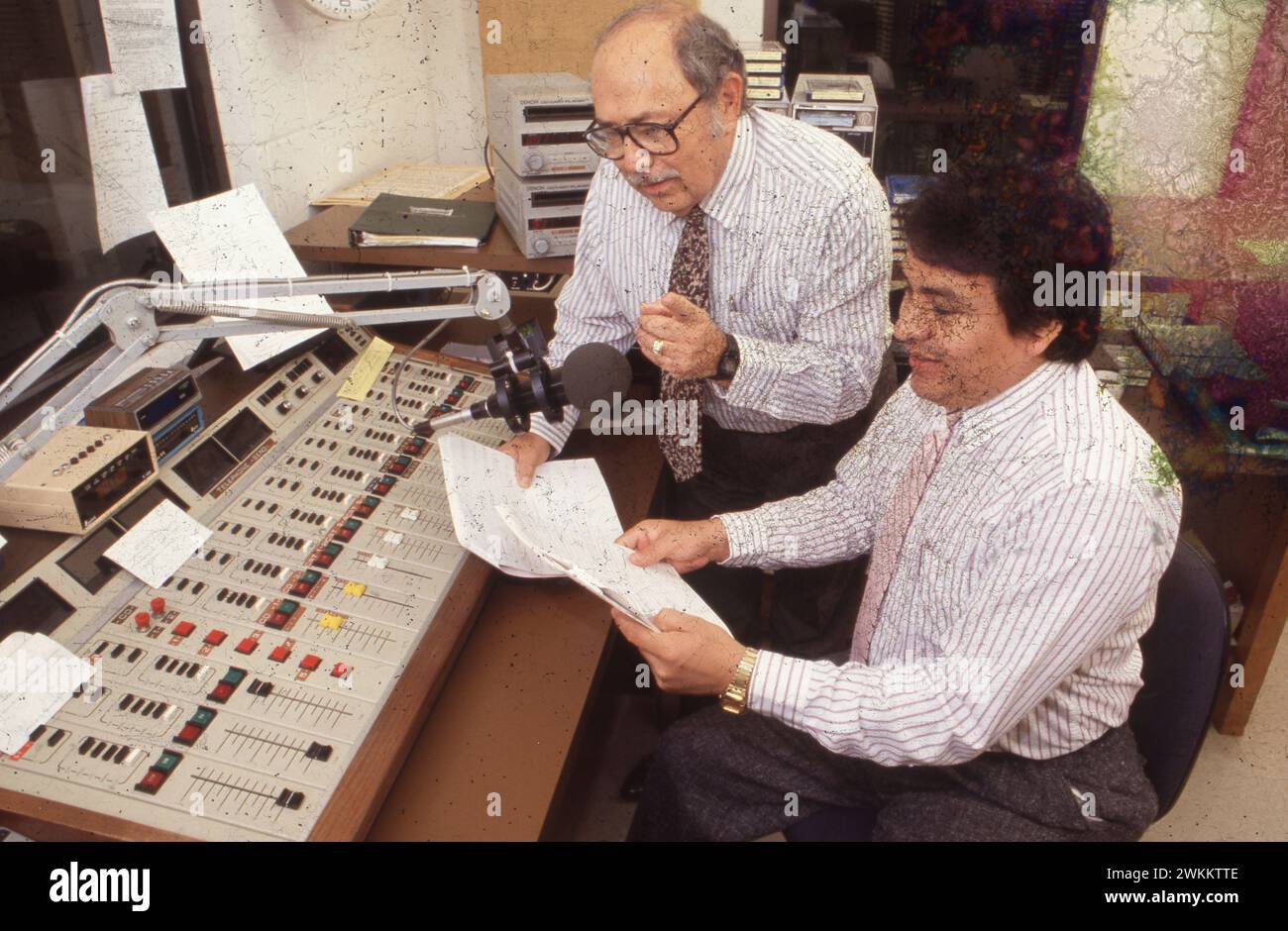 San Antonio Texas USA, 1991: Hispanic radio disc jockey sits at control ...