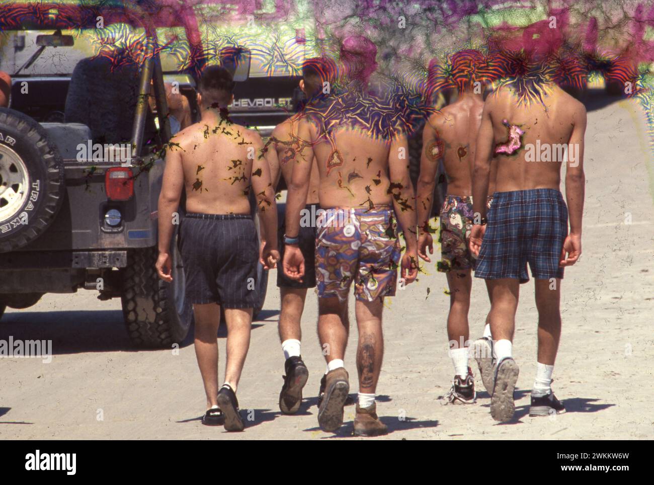 Corpus Christi Texas USA: Teen boys walk along beach crowded with cars ...