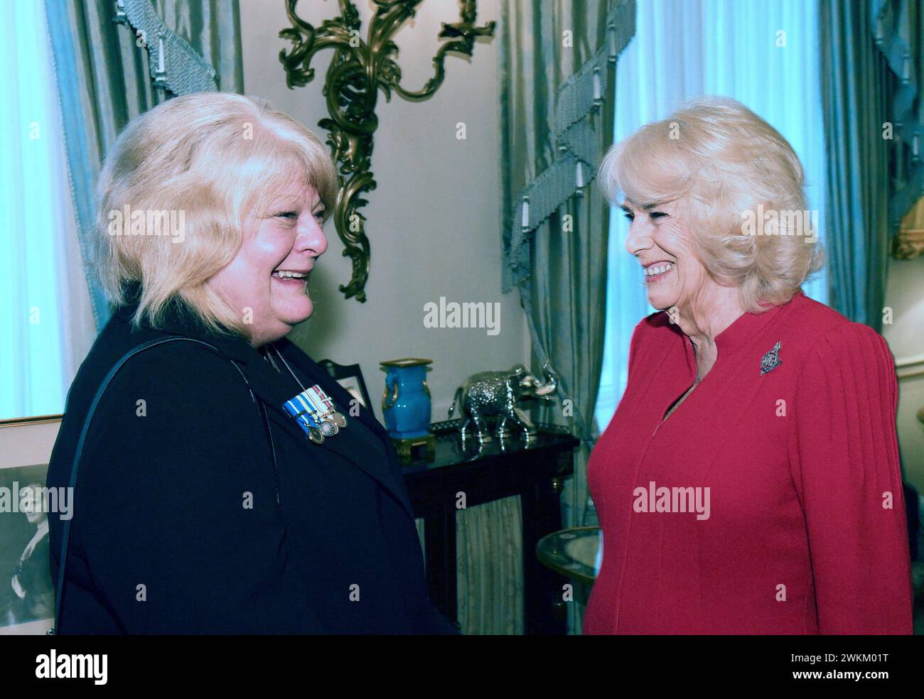 Queen Camilla talks with Mandy Bainbridge, as she meets fund members ...