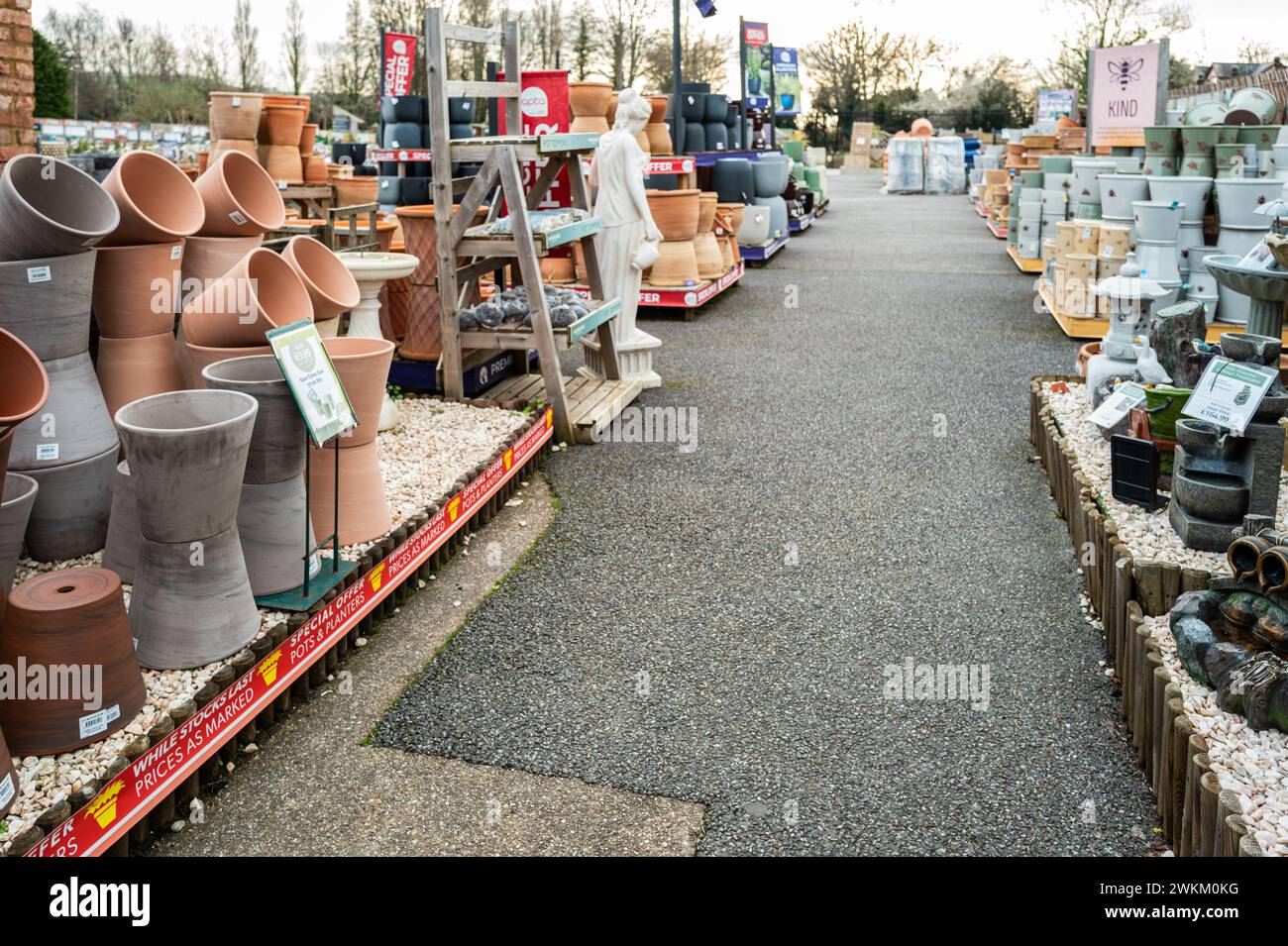 Outside section of a garden centre showing rows of pots and garden ...