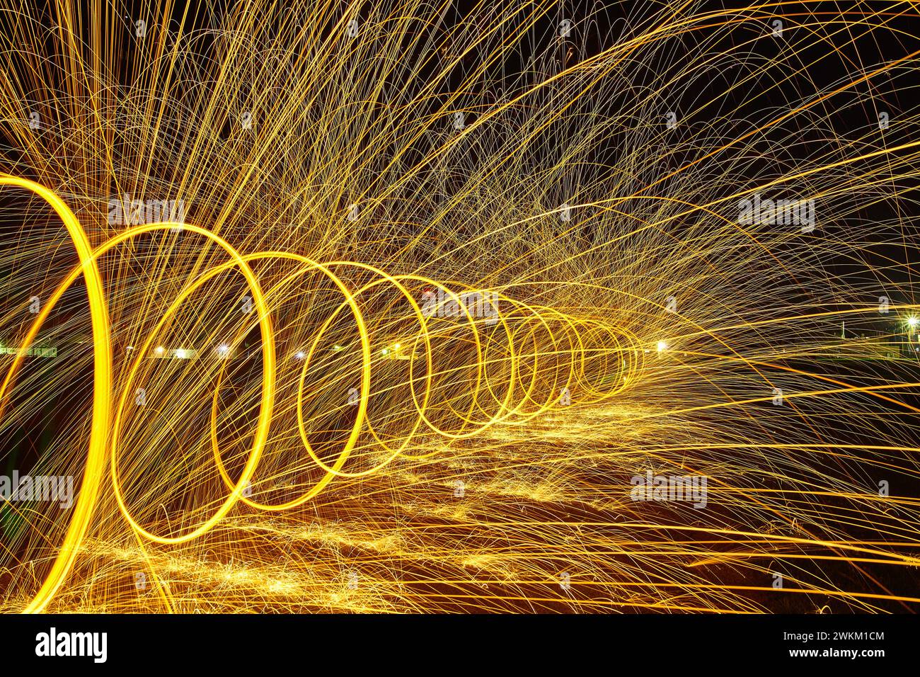 Dynamic Light Painting with Golden Spirals and Steel Wool Trails Stock ...