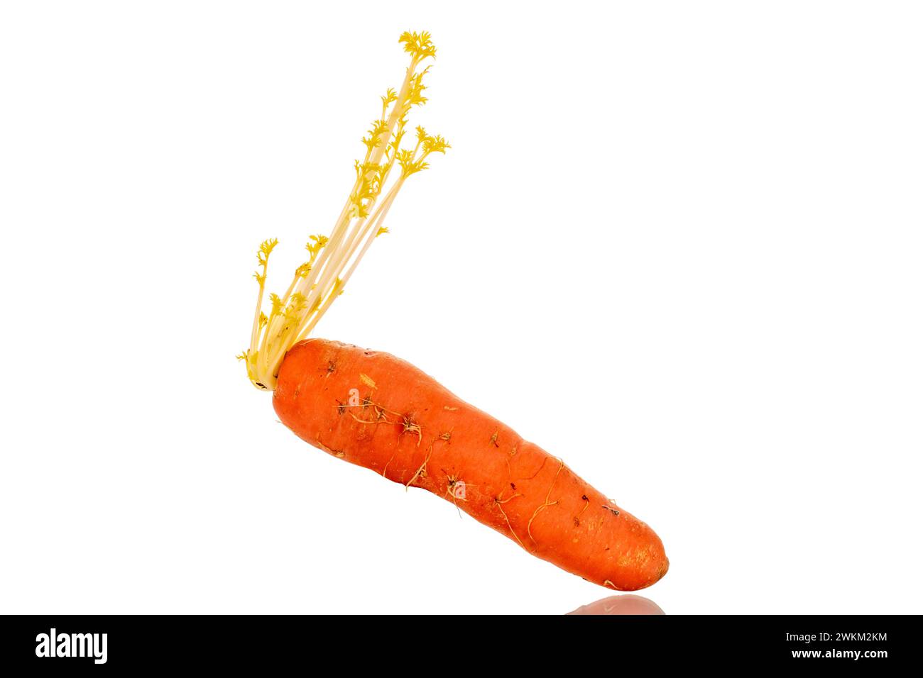 One unpeeled carrot, macro, isolated on white background Stock Photo ...