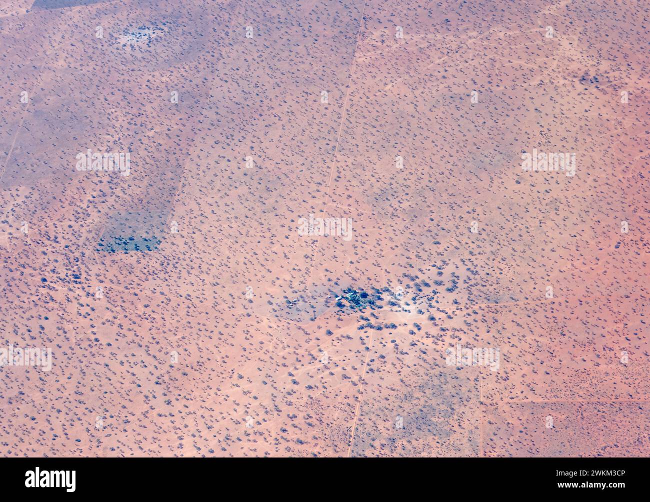 aerial landcape with little farm and sparse vegetation on Kalahari ...
