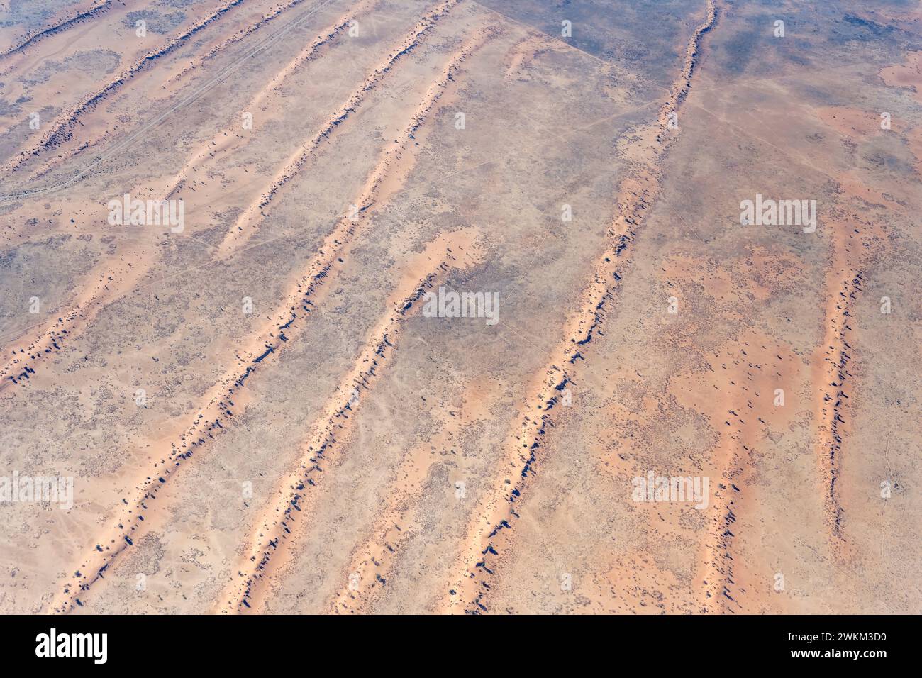 aerial landscape with red sand dune stripes in Kalahari desert, shot ...