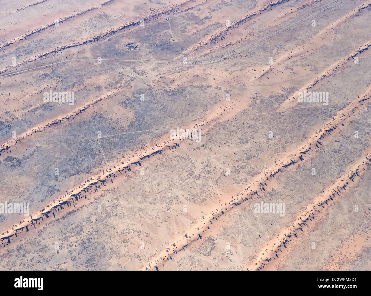 aerial landscape with fences on red sand dune stripes in Kalahari ...