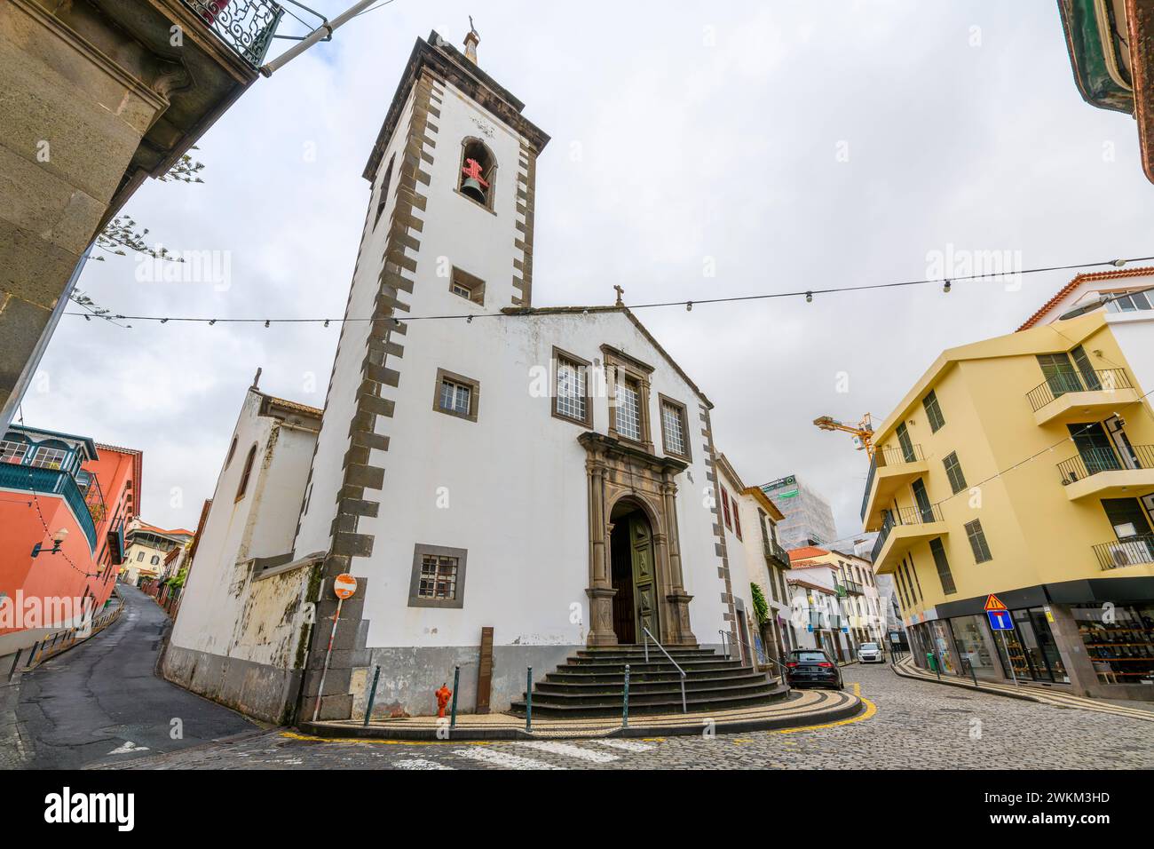 The whitewashed facade and bell tower of the 18th century St. Peter's ...