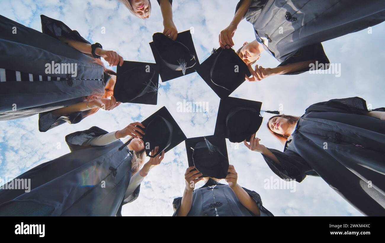 Graduates in robes caps hi-res stock photography and images - Alamy