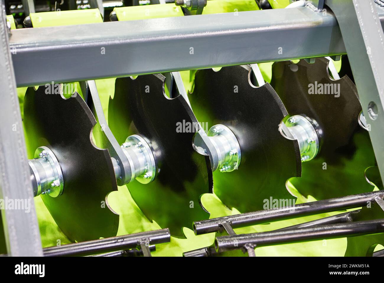 Trailed in-line disc harrow at an agricultural exhibition Stock Photo ...
