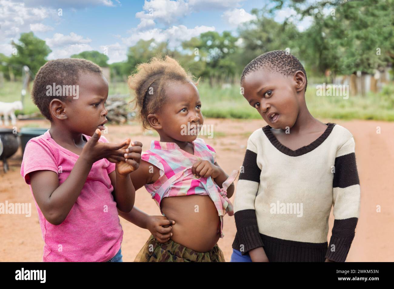 village african kids, playing in the yard , three siblings Stock Photo ...