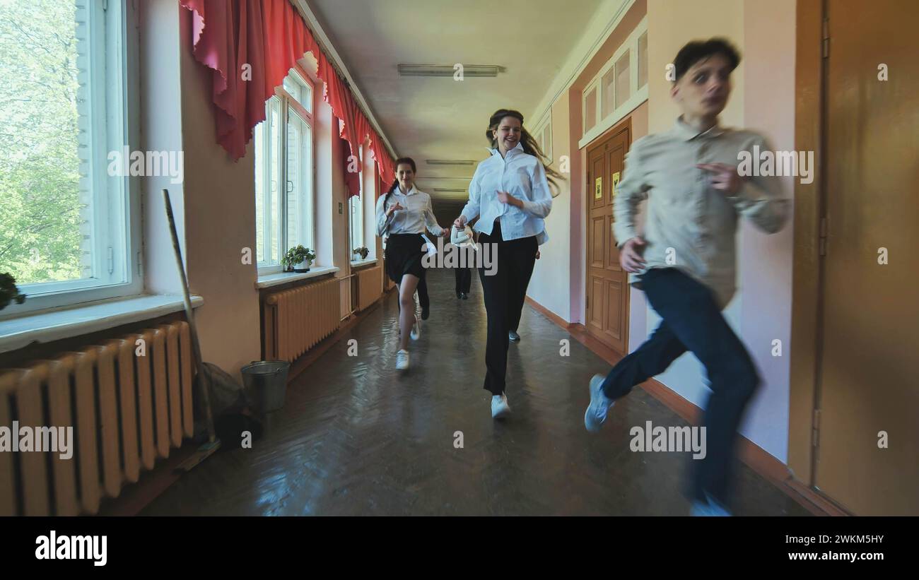 The students are running down the hallway of the school Stock Photo - Alamy