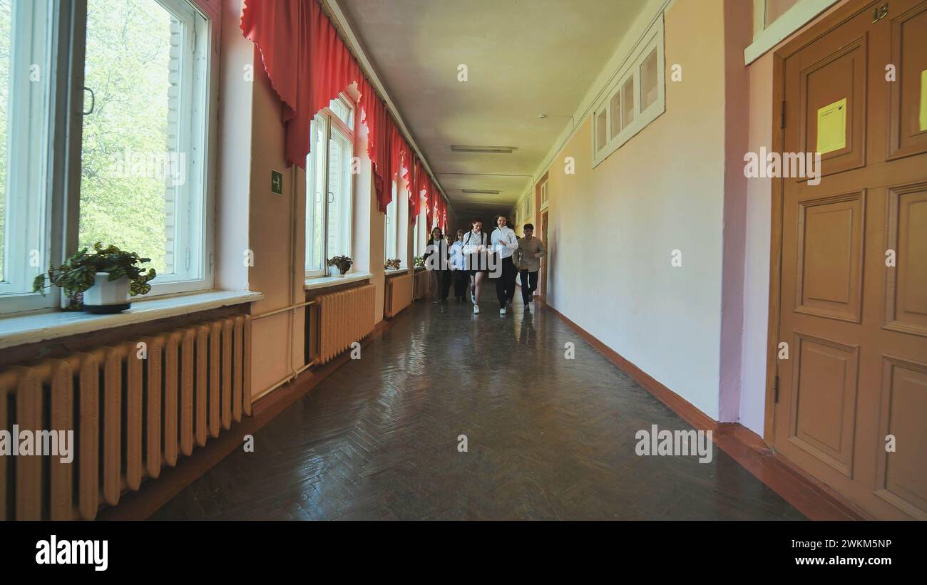 The students are running down the hallway of the school Stock Photo - Alamy