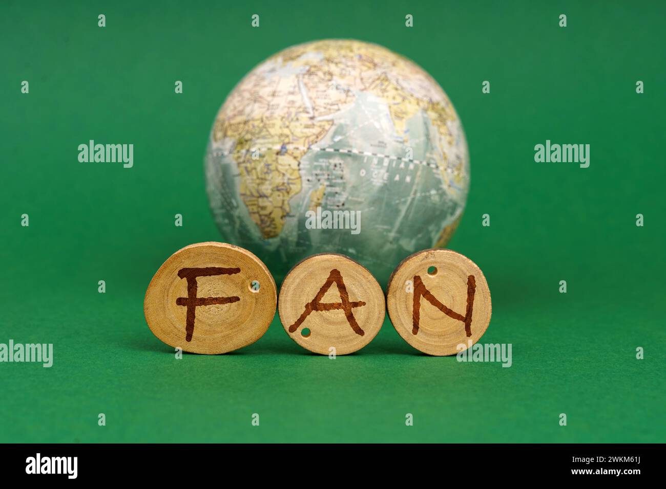 Ecological concept. On a green background there is an Earth globe and ...