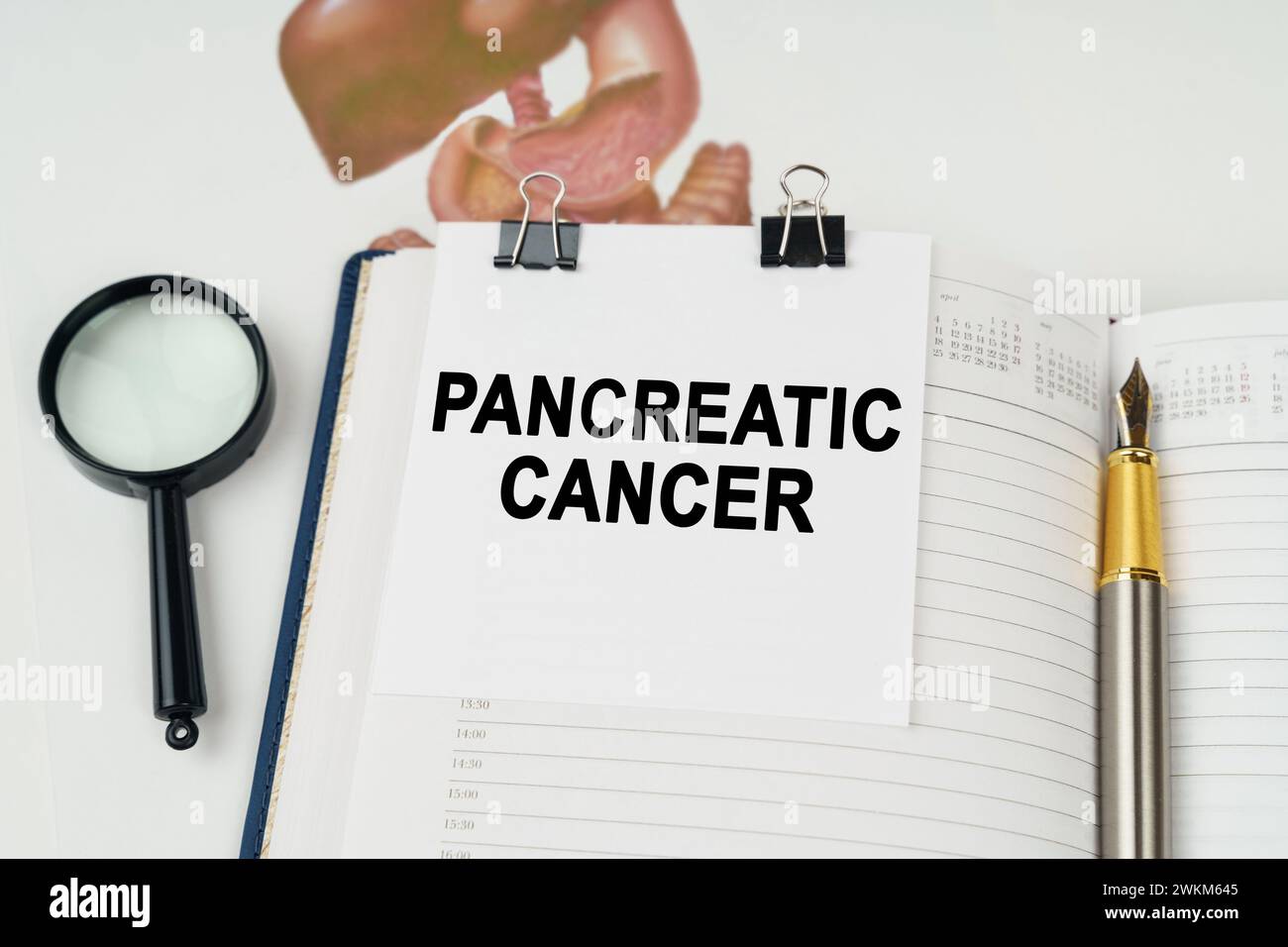 Medical concept. On the table there is a magnifying glass and a notepad ...