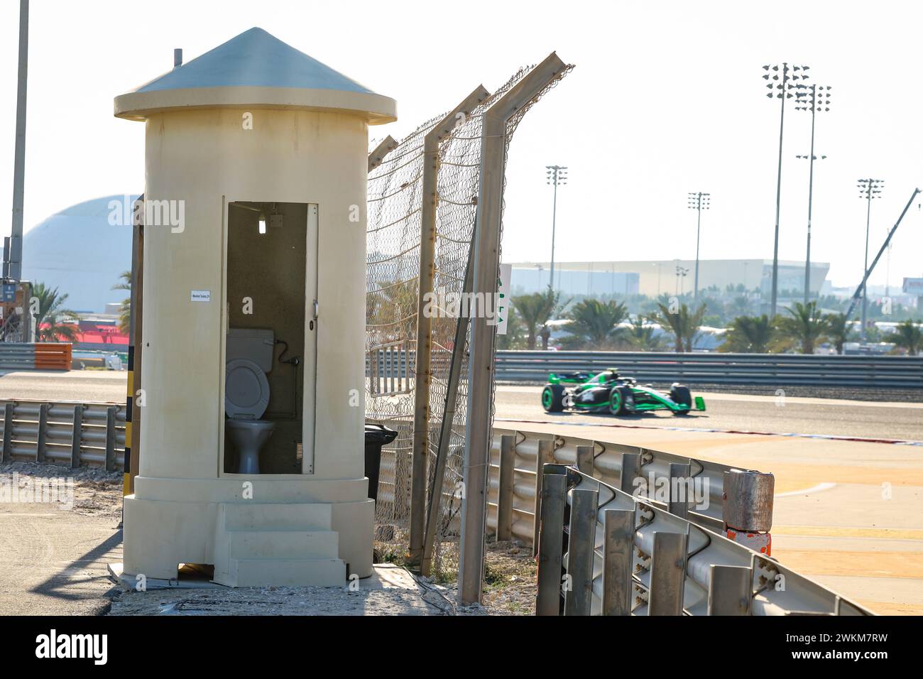Toilet trackside with view on the race track and the Stake F1 Team Kick ...