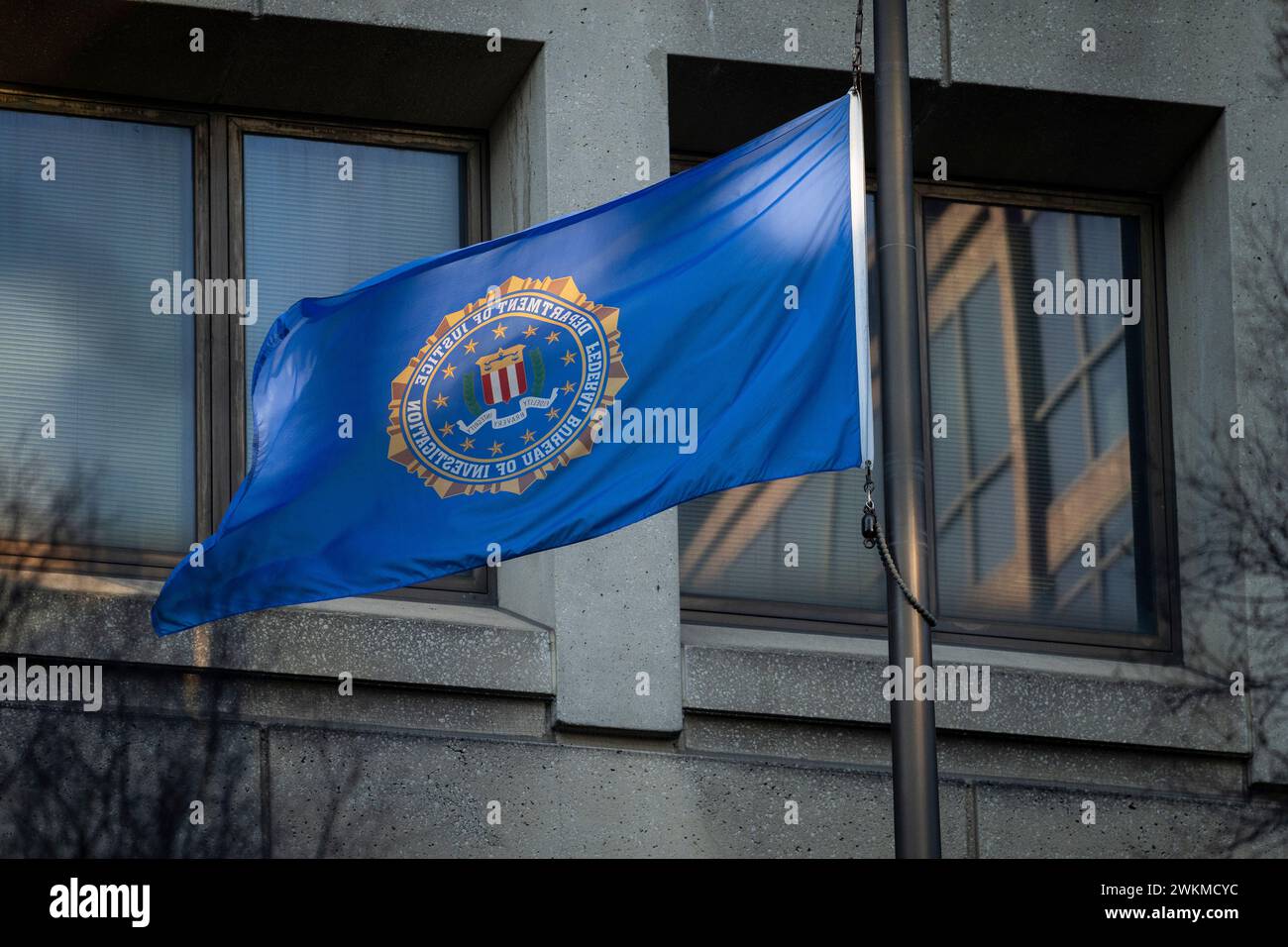 Washington, USA. 21st Feb, 2024. A flag flies in front of the U.S ...