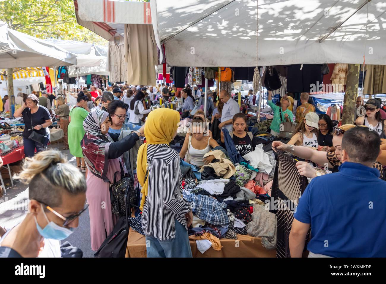 Shopping in flea markets that line the streets of the Navigli area of ...