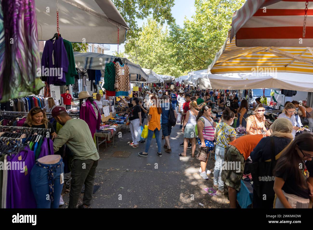 Shopping in flea markets that line the streets of the Navigli area of ...