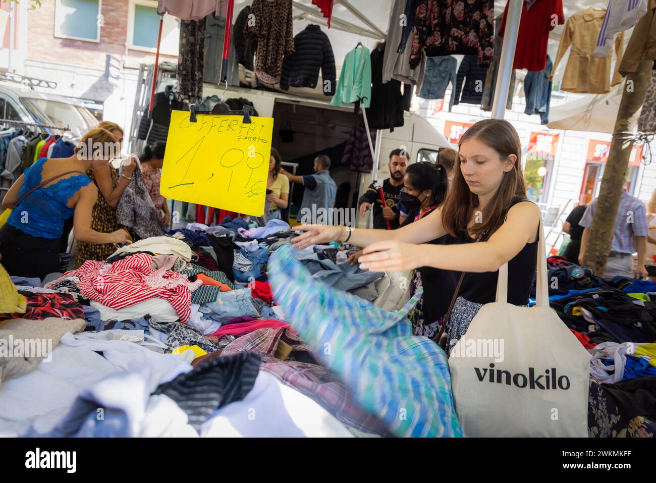 Shopping in flea markets that line the streets of the Navigli area of ...
