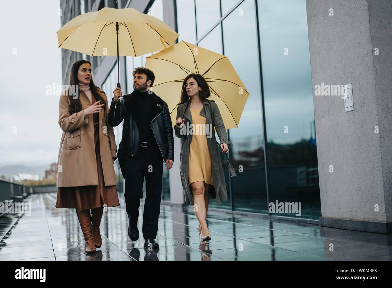 Group people rain protecting hi-res stock photography and images - Alamy