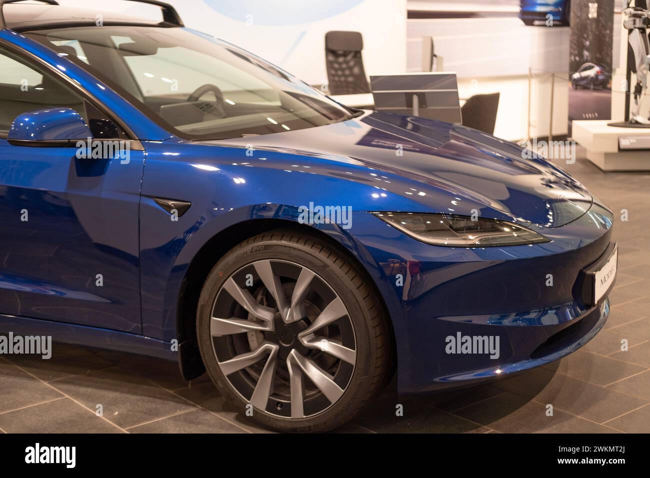 blue Tesla electric car model 3 in Studio, autopilot and eco-friendly ...