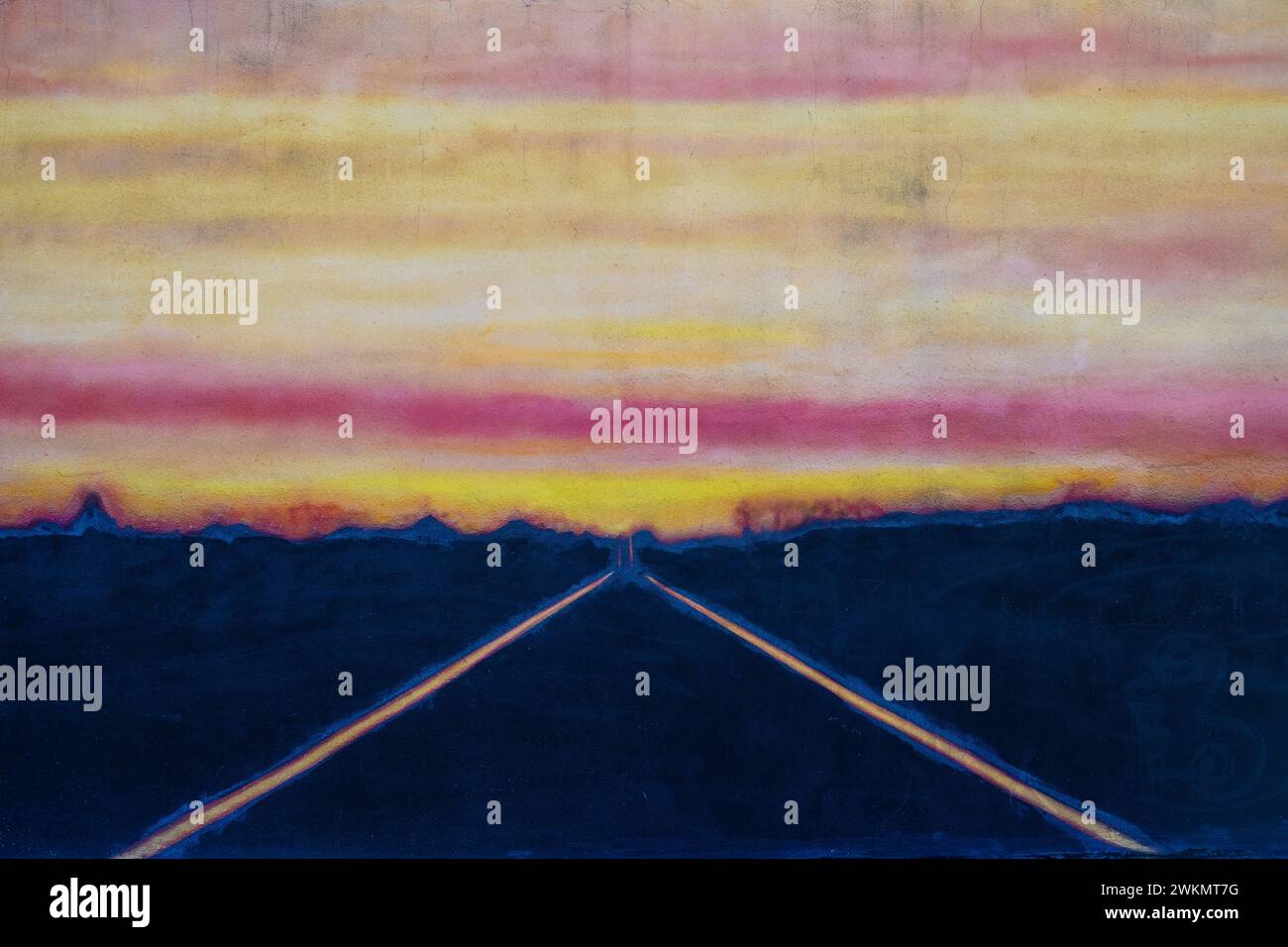 train track mural going into the sunset Stock Photo - Alamy
