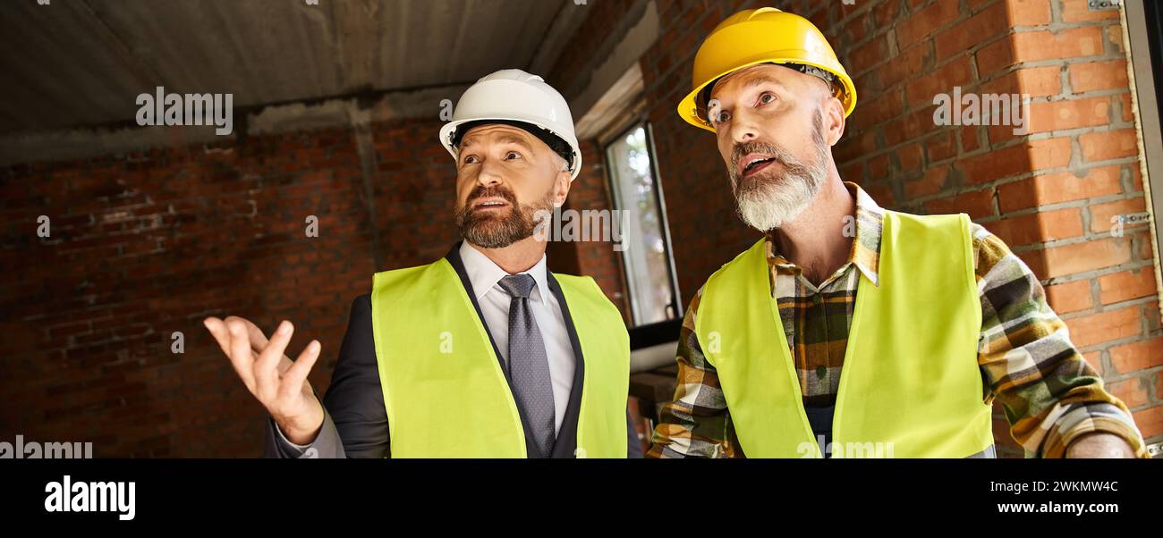 attractive jolly cottage builder and architect discussing their work on ...